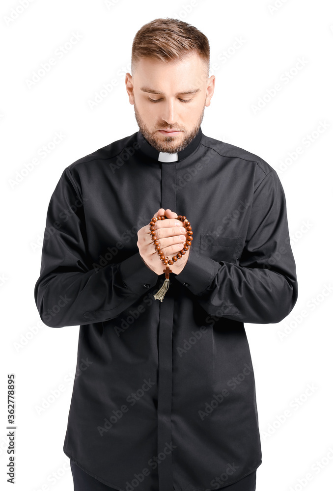 Young priest praying to God on white background Stock Photo | Adobe Stock