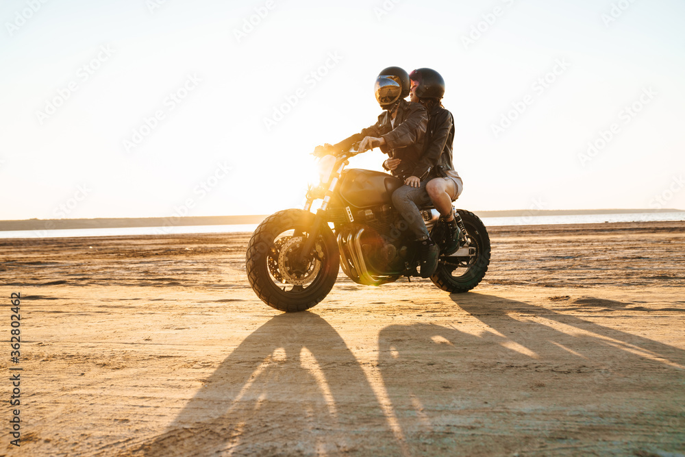 Beautiful young stylish couple enjoying ride on a motorbike Stock Photo ...
