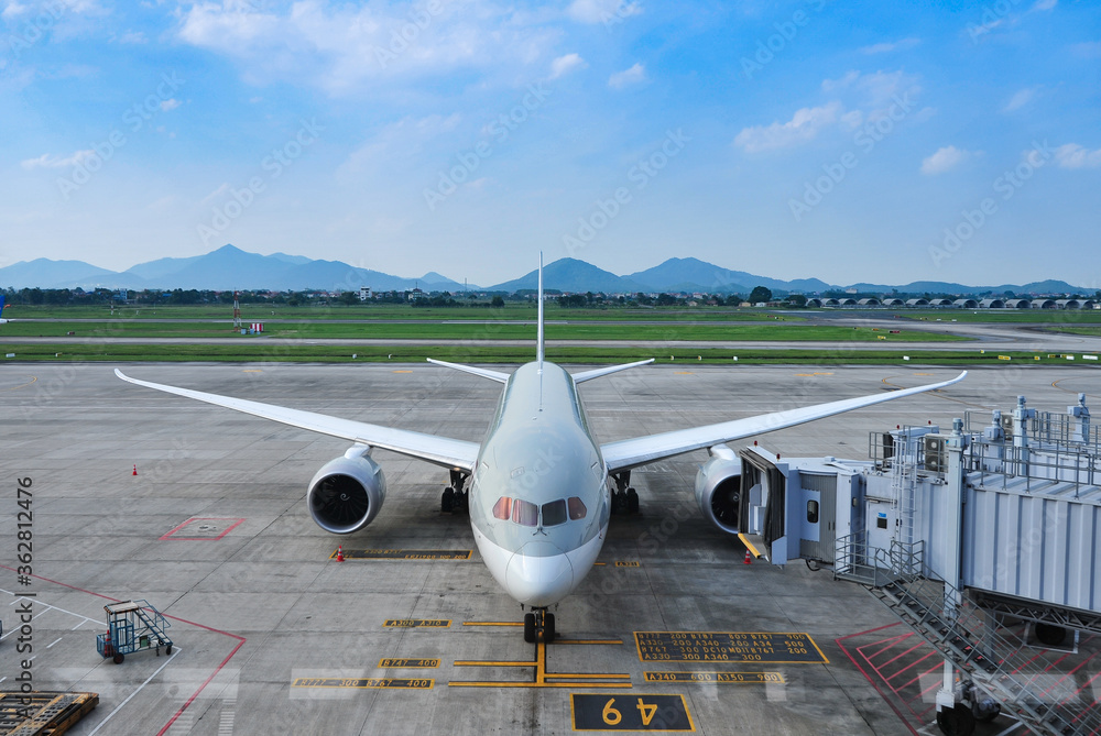 aircraft docking at the airport Stock Photo | Adobe Stock