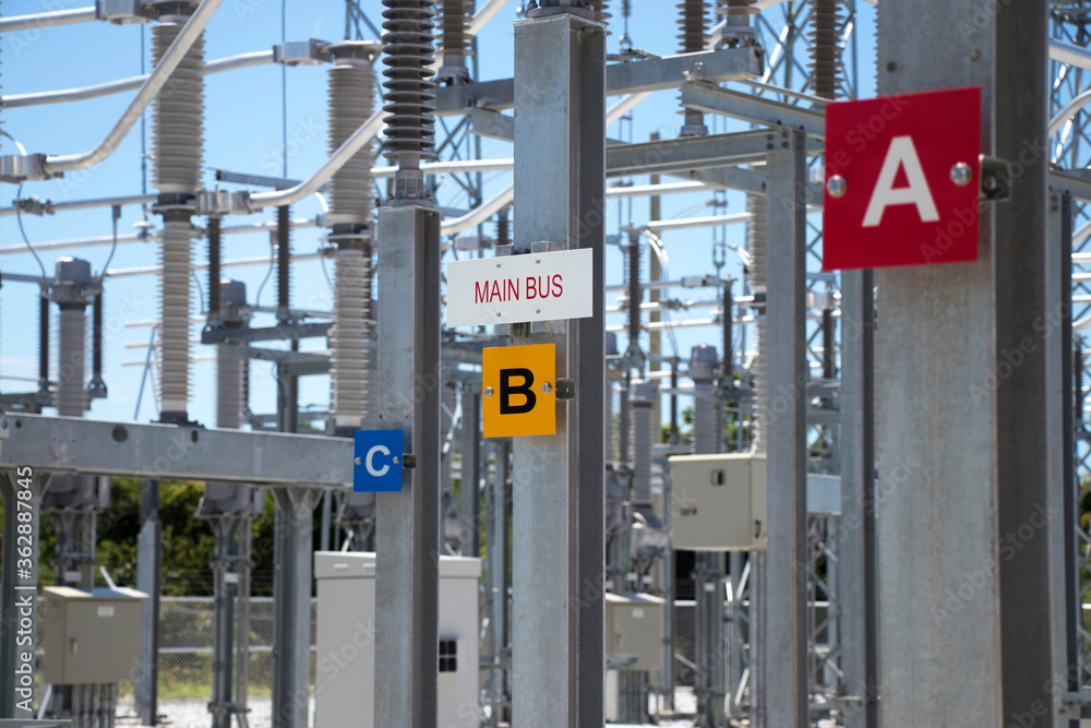 Sign showing main bus of a three-phase electrical system in the power ...