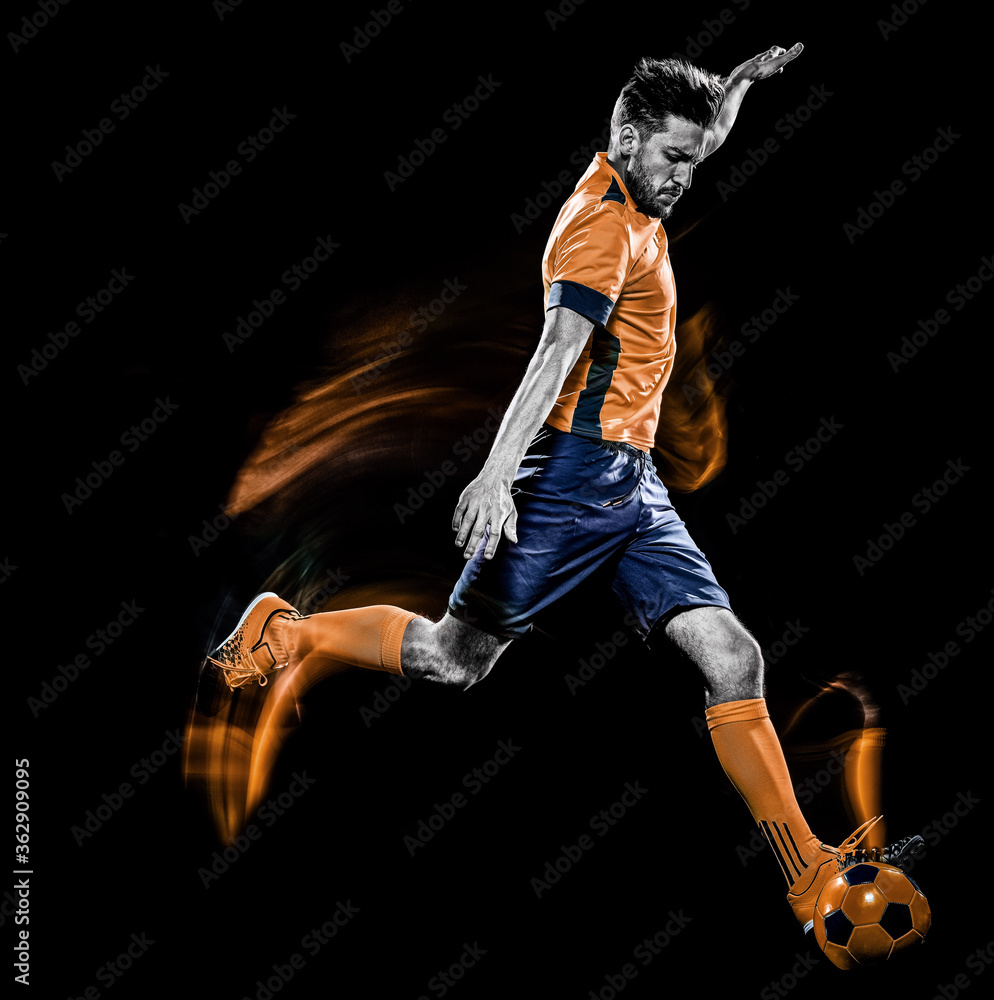 one caucasian soccer player man isolated on black background with light ...
