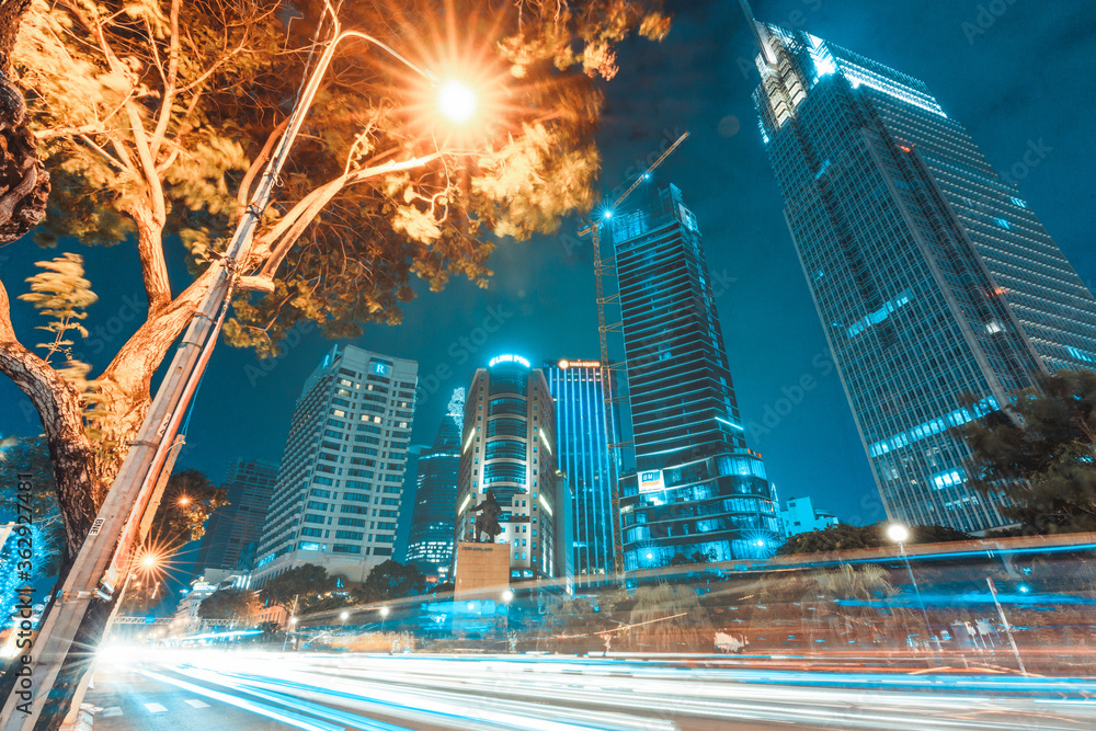 traffic in the street against Bitexco Financial Tower, Renaissance ...