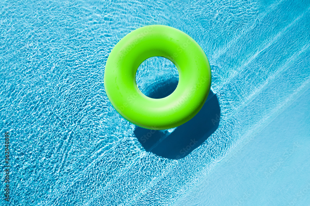Inflatable ring floating in swimming pool, top view. Summer vacation ...