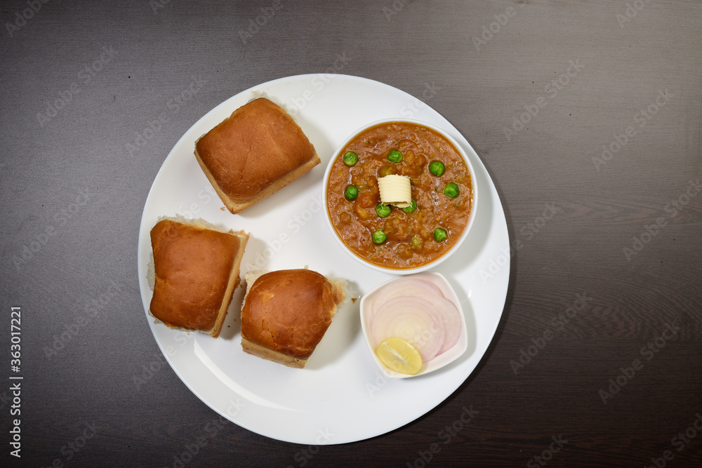 Pav Bhaji is a fast food dish from India, Thick and spicy vegetable ...