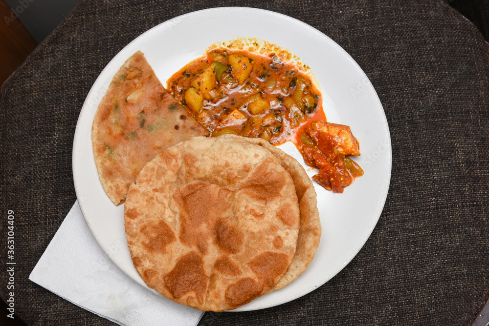 Bedmi puri, Poori, methi paratha with aloo ki sabzi potato curry, top ...