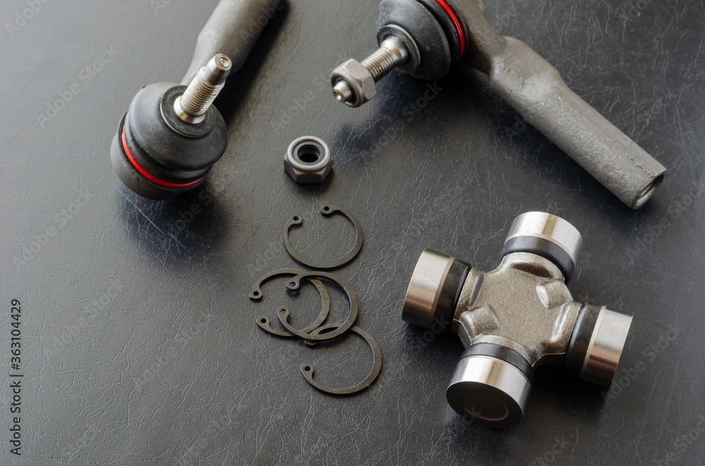 Cross joint of the propeller shaft and a set of tie rod ends. Stock ...