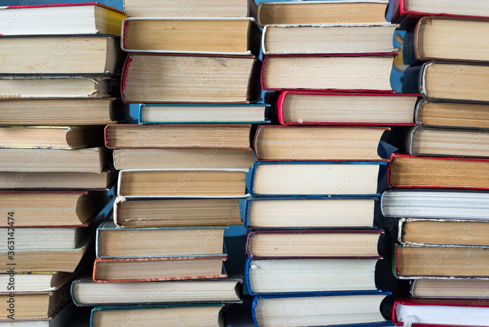 Stack of books background. a lot of books. A stack of books of ...