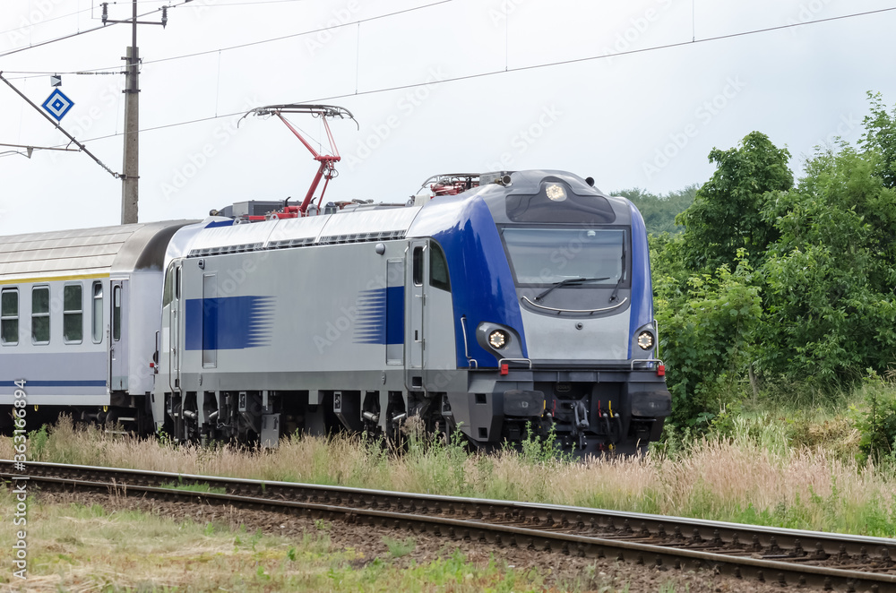 EXPRESS TRAIN - Locomotive with a composition of passenger wagons on ...