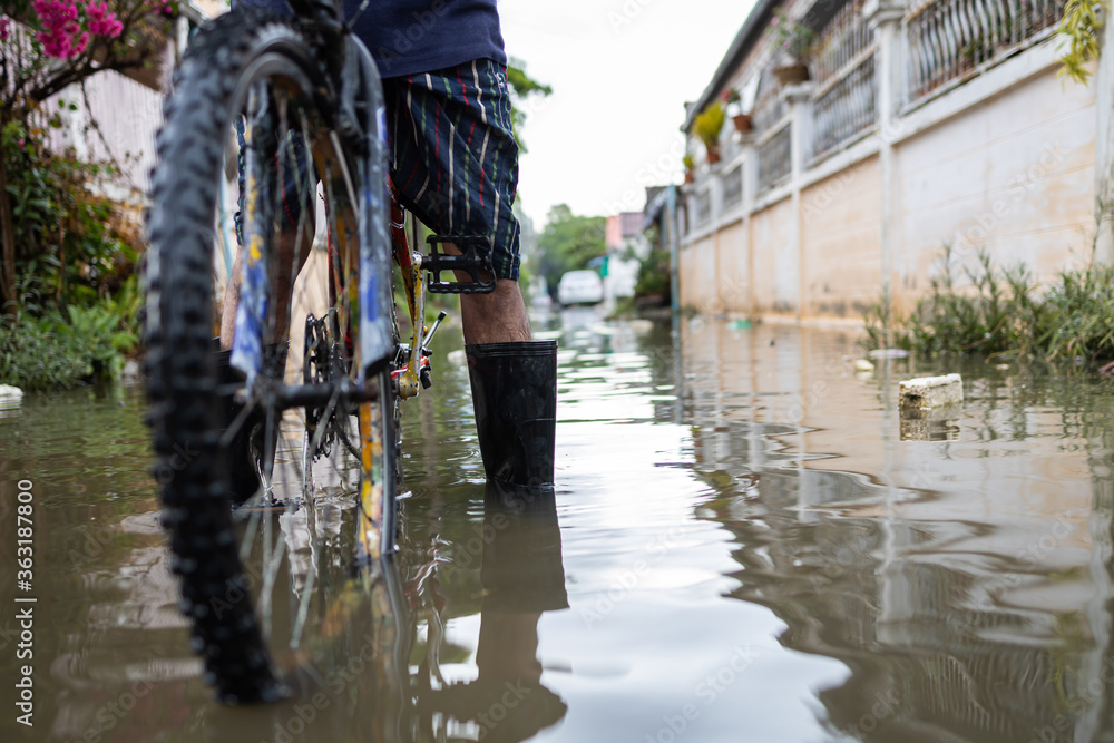 Legs with rubber boots in flooding,Asian man wear waterproof boots with ...