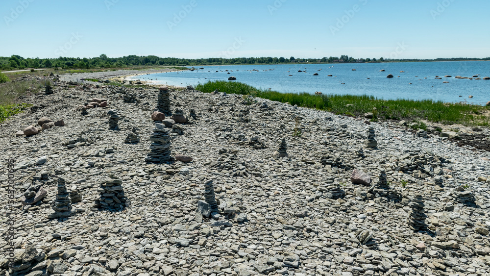 beautiful white stone piles by the sea, these objects were built by ...