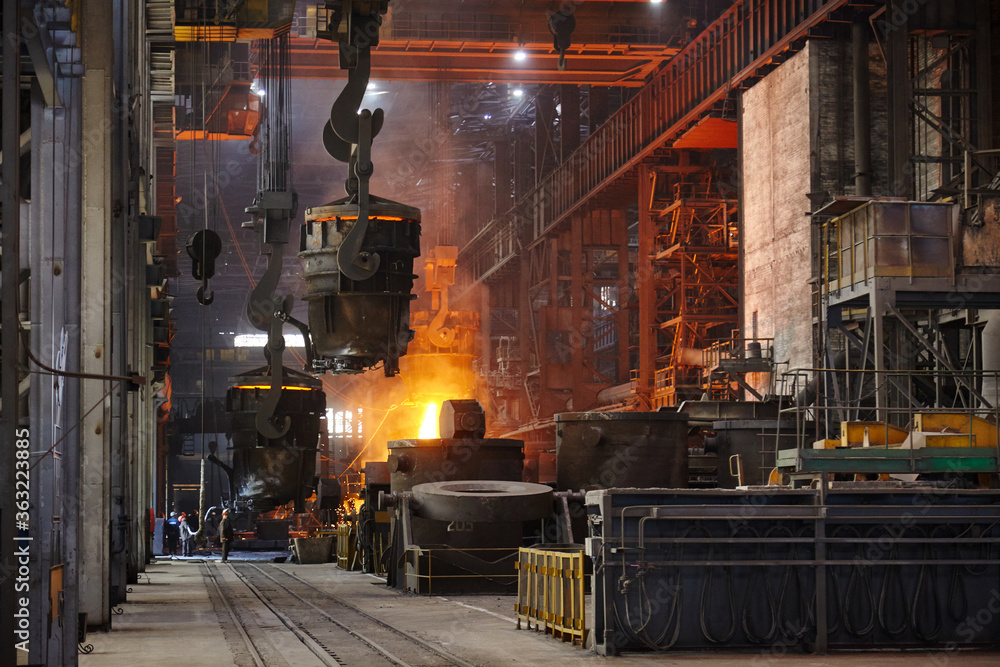 Steelmaker at ingot casting. Electric arc furnace shop EAF. Metallurgy ...