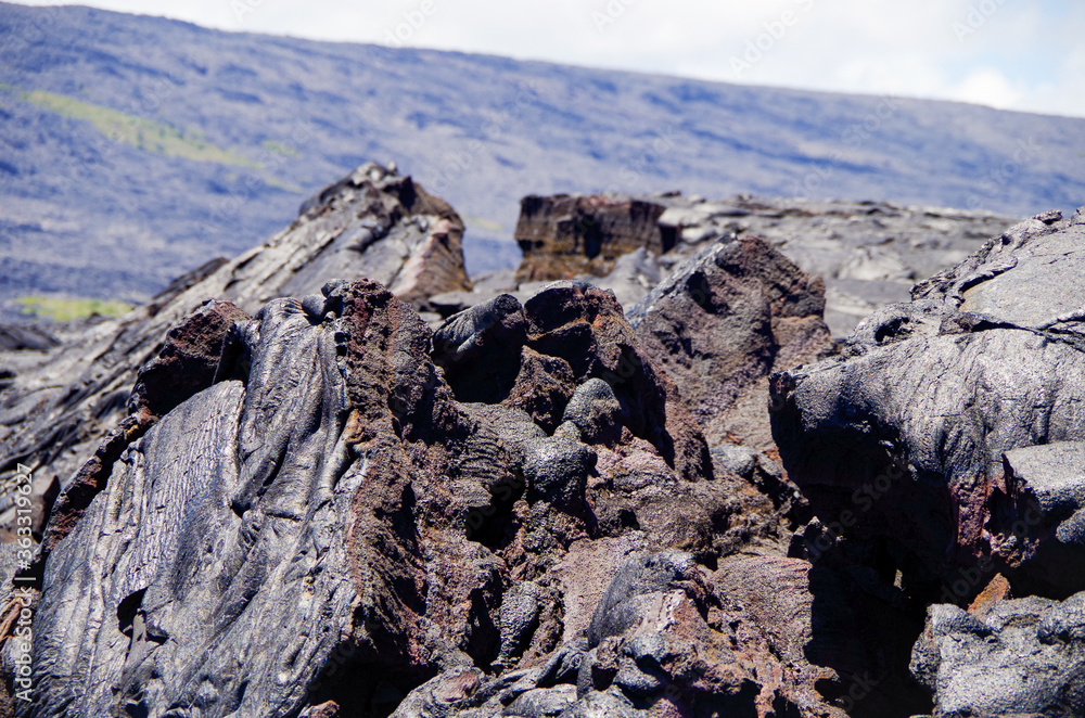 Surreal formations of cool and solidifyied black lava rock flow with ...