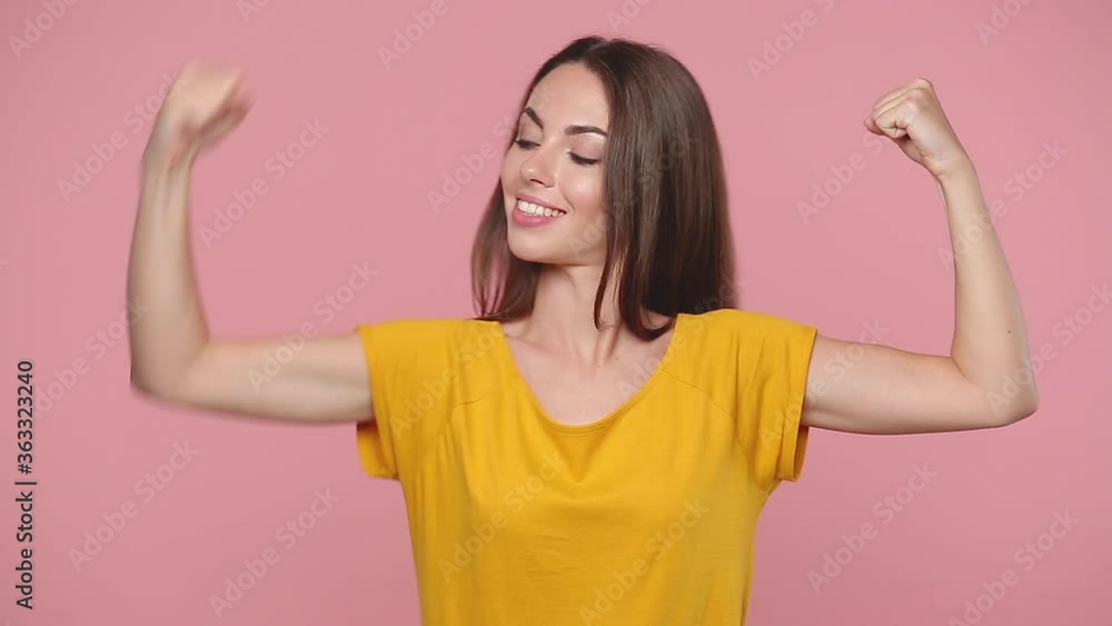 Strong sporty fitness young woman girl 20s years old in yellow t-shirt ...