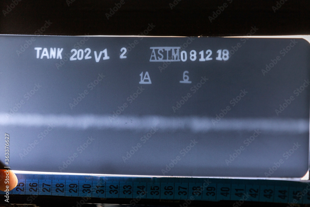 View of the industrial radiography of the weld metal with porosities ...