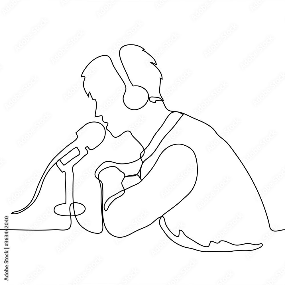 man with headphones sits at the microphone and broadcasts. One ...