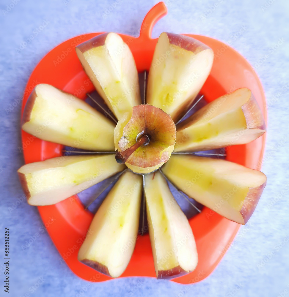 Apple shown beautifully in apple cutter like flower shape and it tempts ...