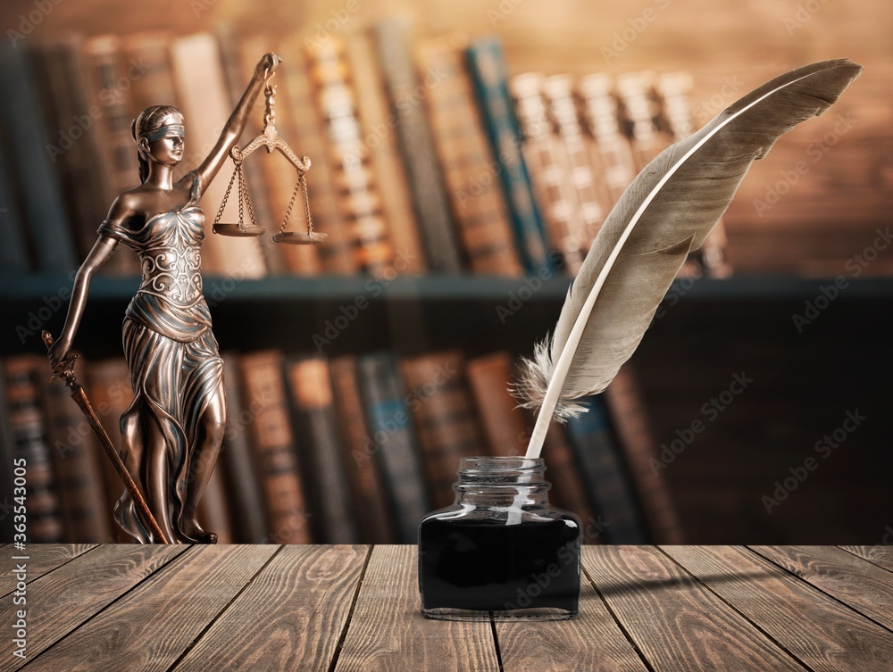 Feather quill pen and glass inkwell on desk Stock Photo | Adobe Stock