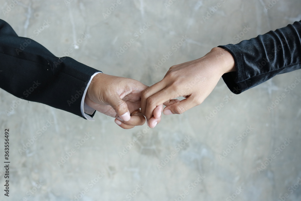 The couple holding hands. The bonds of love hold each other. Male and ...