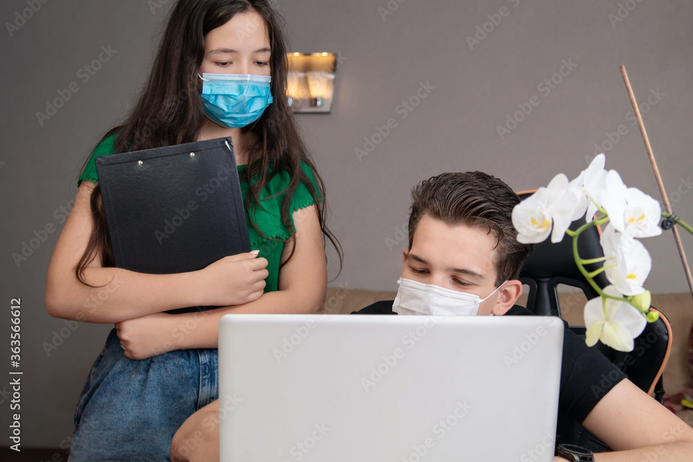 Students are preparing a project together during a pandemic, on the ...