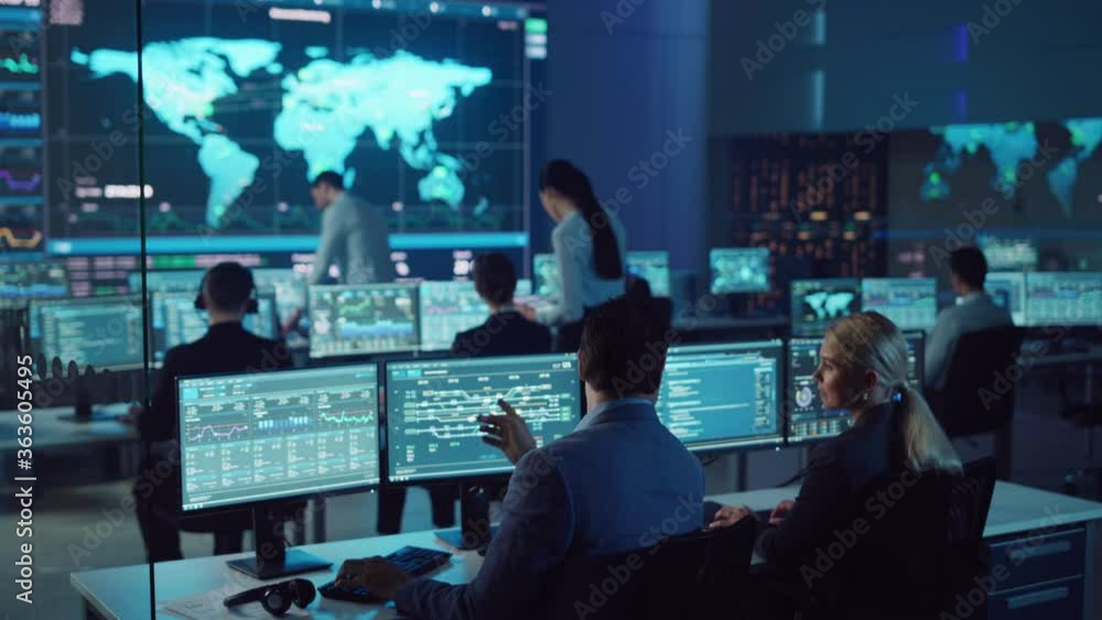 Team of Professional Computer Data Science Engineers Work on Desktops ...