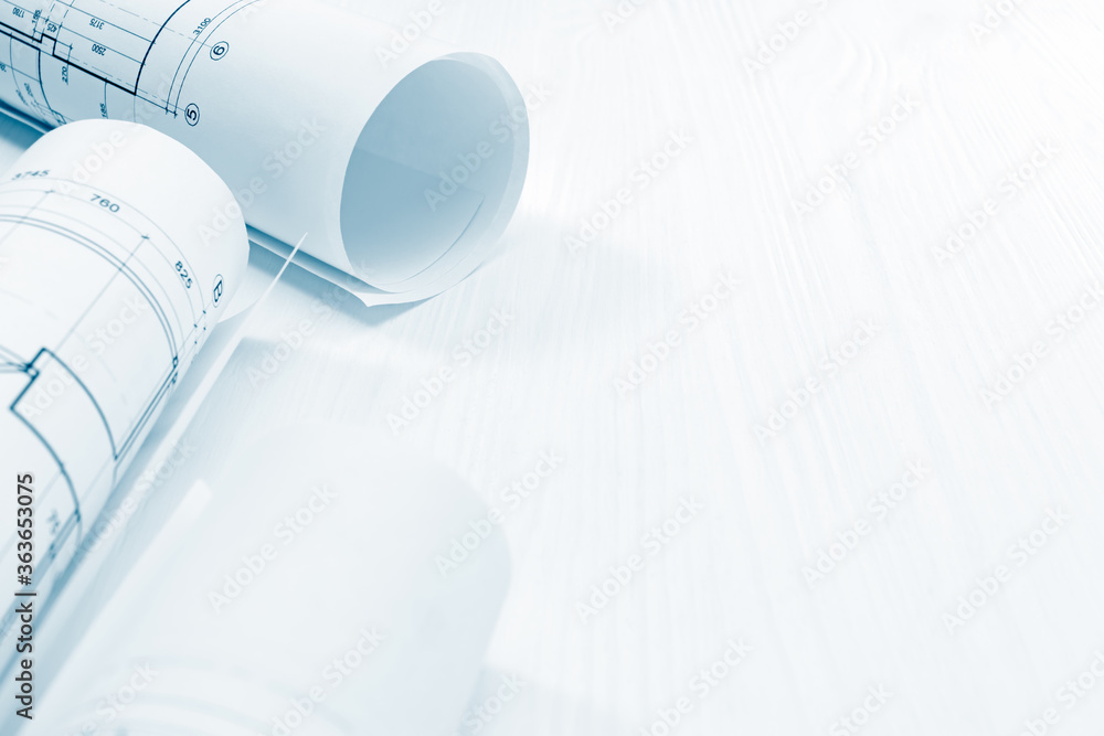 architect blueprint rolls and technical drawing. construction ...