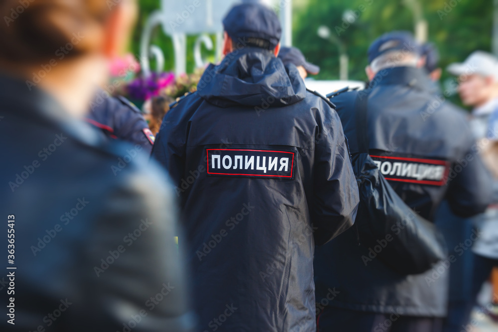 Russian police squad formation back view with "Police" emblem on ...