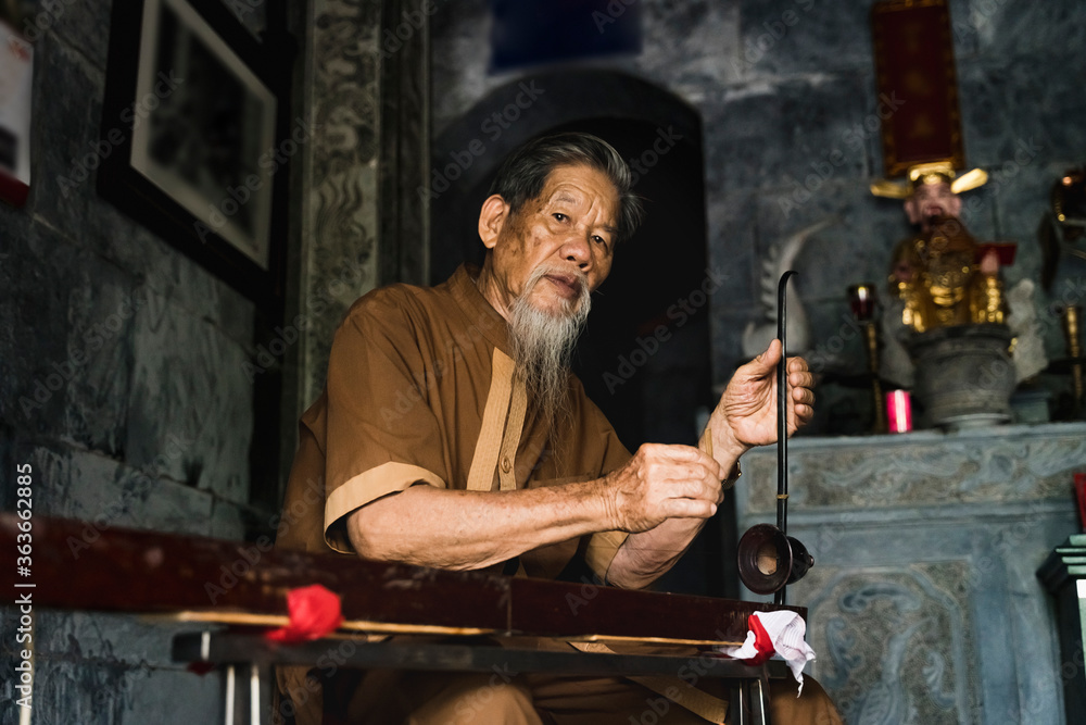 Monk Inside A Temple In Vietnam Stock Photo | Adobe Stock