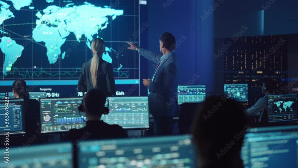 Project Manager and Computer Science Engineer Talking while Using Big ...