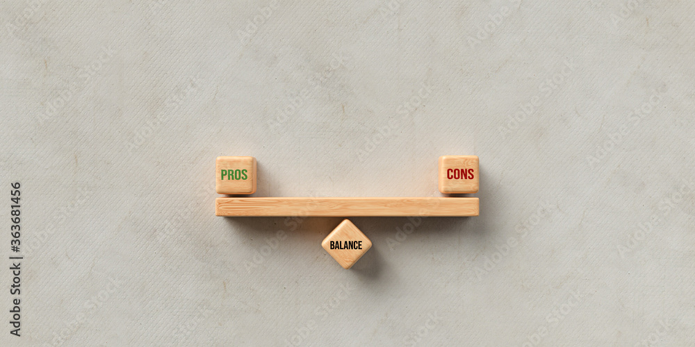 cubes forming scale with the words PROS, CONS and BALANCE on concrete ...