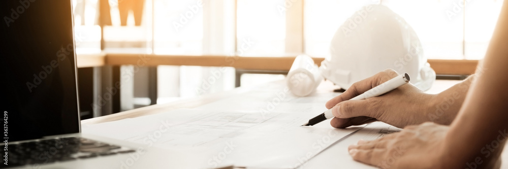 Engineer of architect starting draw a house blueprint on the desk in ...