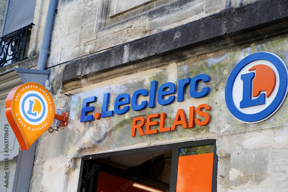 E.leclerc relais text logo and round sign on building facade of shop ...