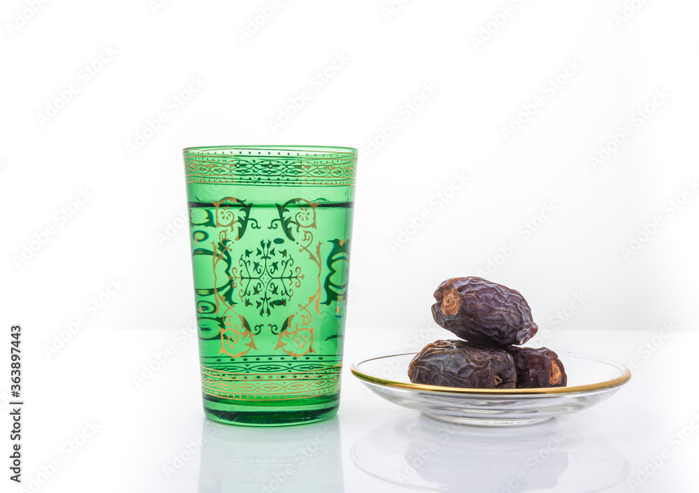 Glass of drinking water and date fruits are usually consumed before ...