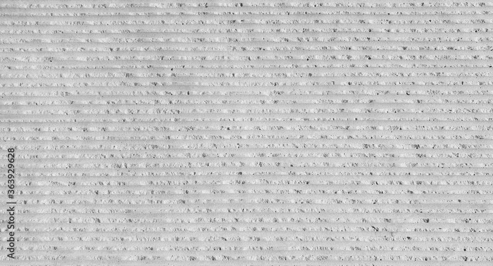 close up view of striped concrete surface sample. abstract design of ...