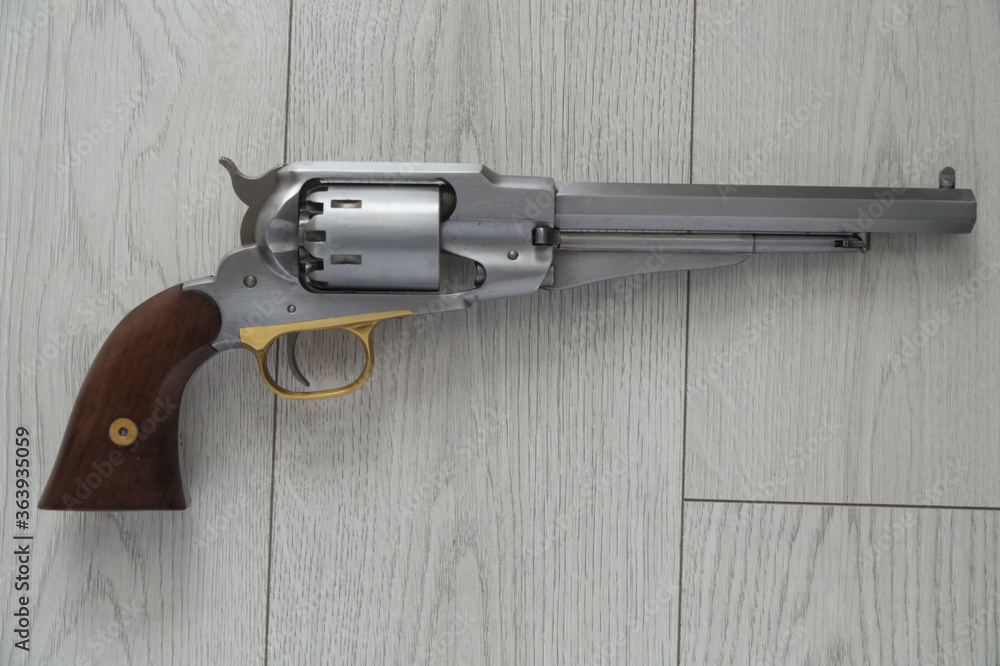 Old black powder cap and ball gun on white wooden background Stock ...