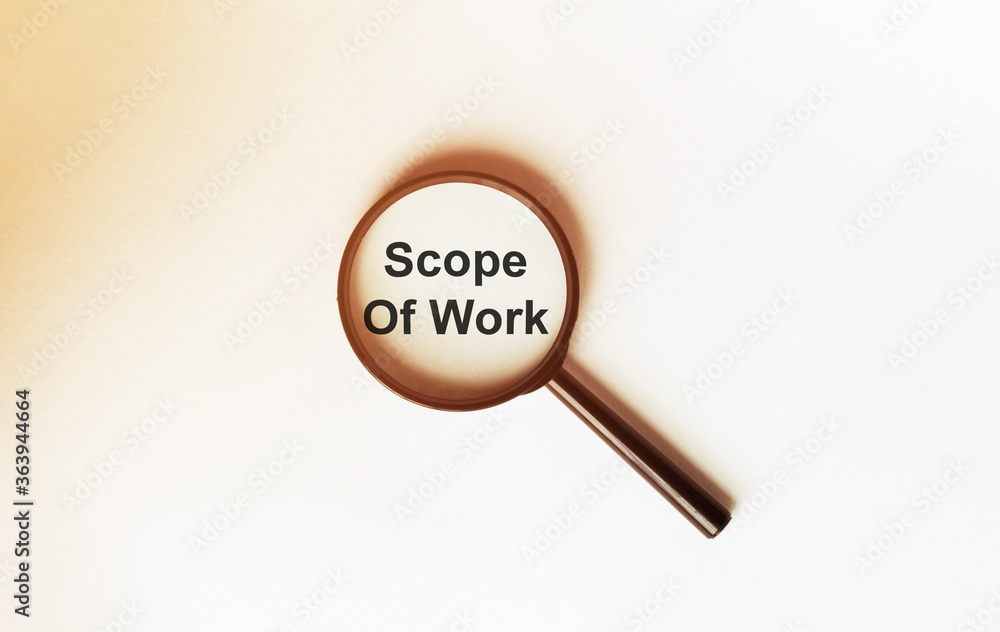 Scope Of Work on a sheet under a magnifying glass Stock Photo | Adobe Stock