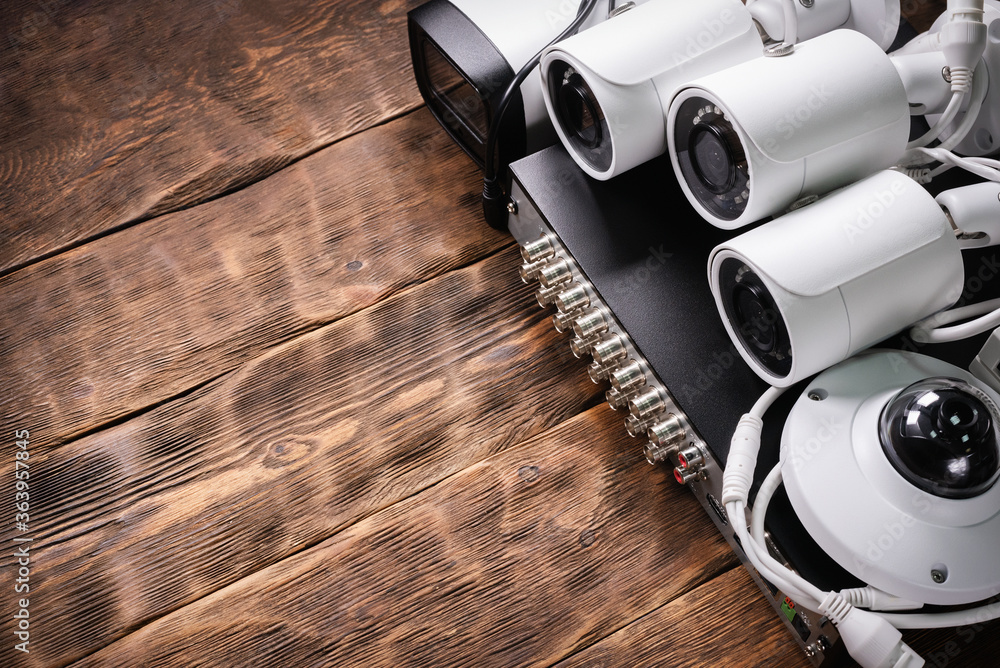 Modern white security cameras on the table background. Video ...