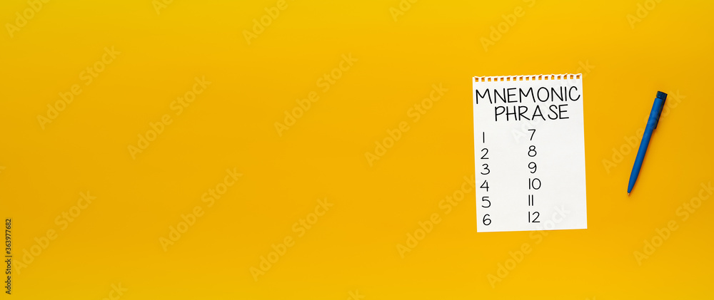 Mnemonic phrase concept. sheet of paper on an orange background with ...