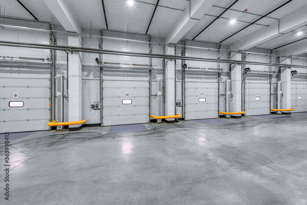 Loading gates of a large industrial warehouse. Industrial interior ...