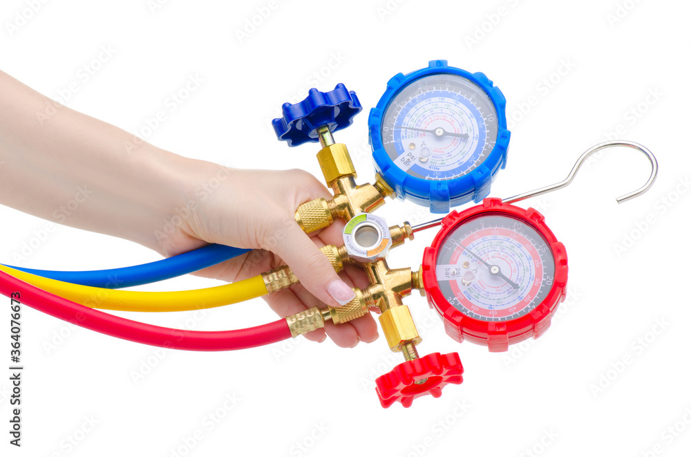 Hand holding gauge station, pressure gauge, manometer on white ...