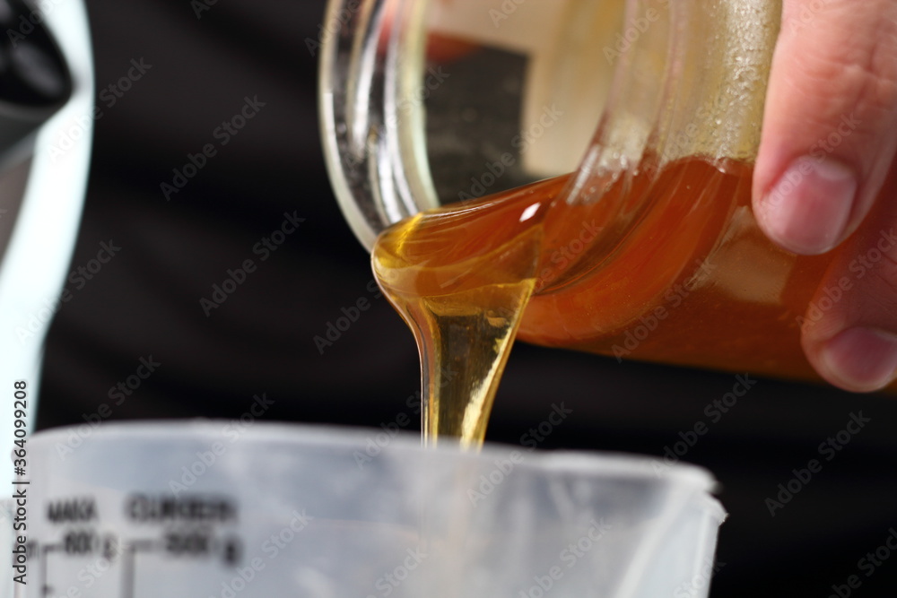Pouring golden syrup into measuring cup. Making Shoofly Tart Series ...