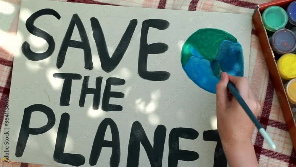 young kids drawing Save the planet Poster in summer camp. volunteer child painting earth banner ...