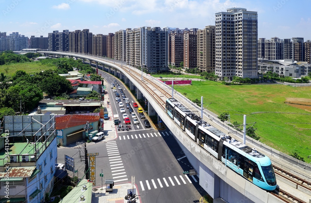 Aerial view of metro trains passing each other on a curve near Xinshi ...