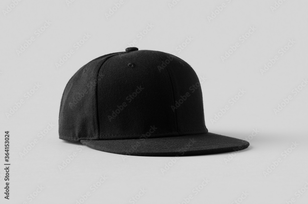 Black snapback cap mockup on a grey background. Stock Photo | Adobe Stock
