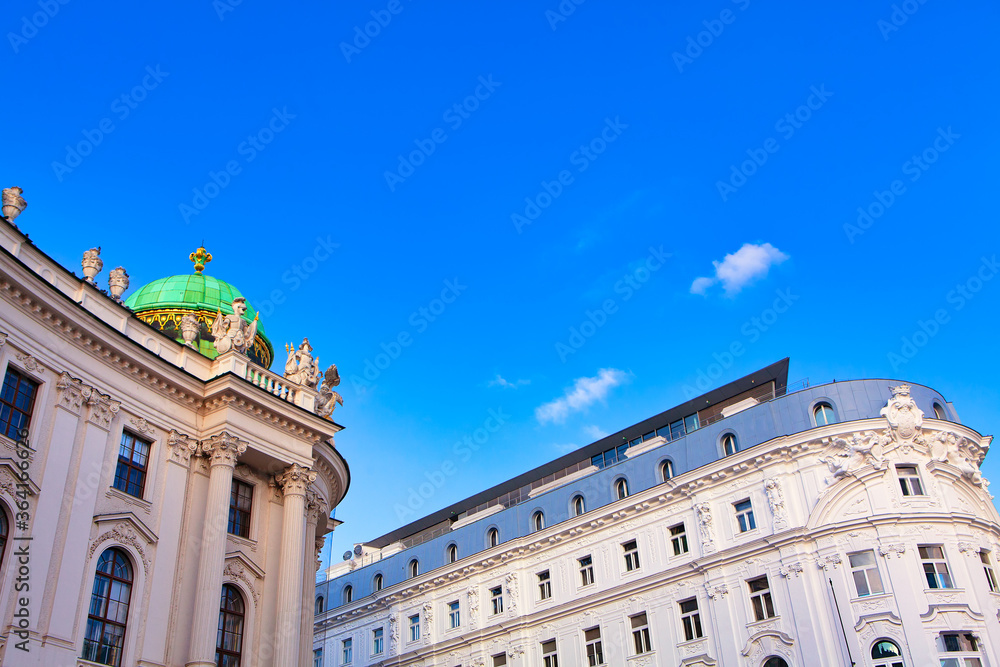 classical Viennese architecture with sculptures on the rooftop Stock ...