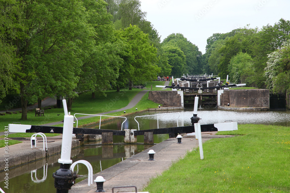 Beautiful canal in United Kingdom, featuring trees, water and boats ...