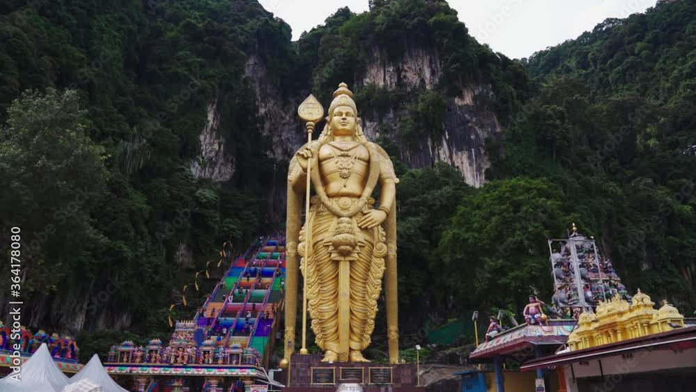 Indian temple in Batu caves near Kuala lumpur. In front of the temple ...