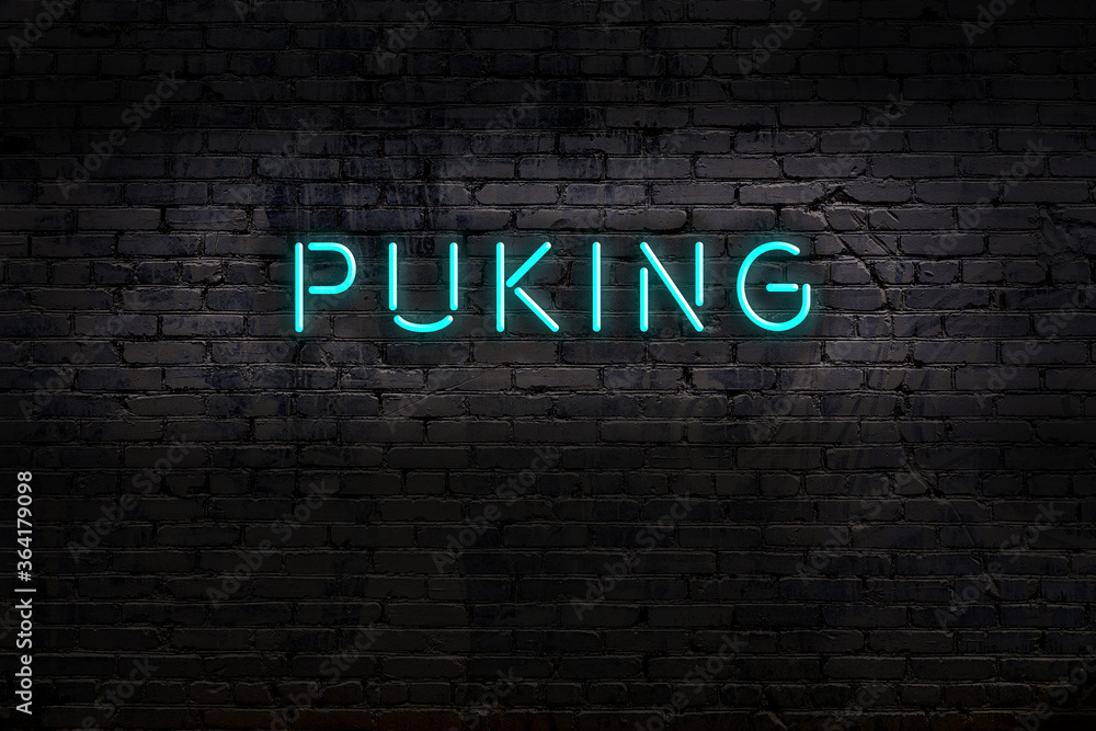 Neon sign. Word puking against brick wall. Night view Stock ...