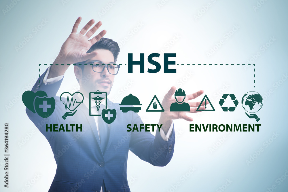 HSE concept with businessman pressing virtual button Stock Photo ...