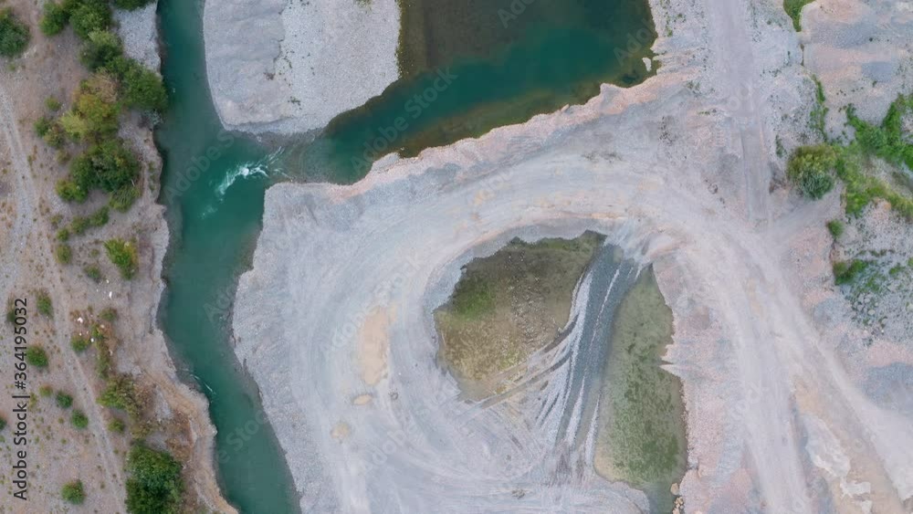 Sand and gravel extraction from river bed and banks. Raw natural ...