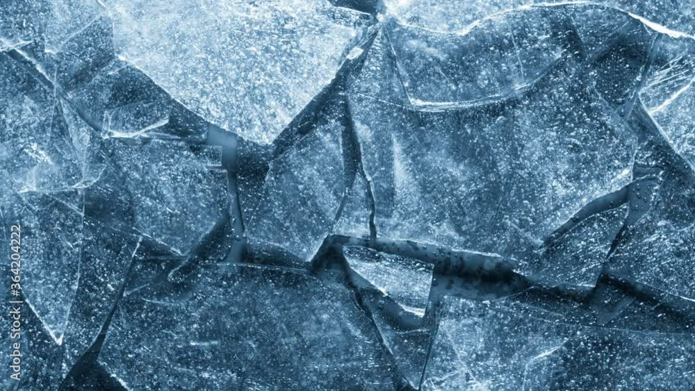 Close-up of melting ice texture. Studio shot close-up of the blue ...